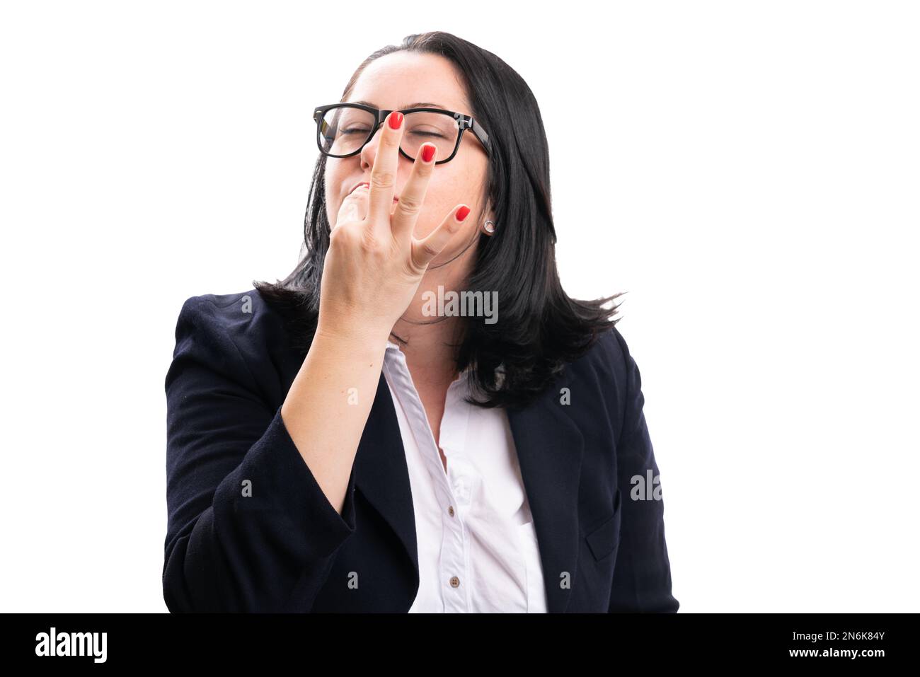 Businesswoman with pleased expression making italian chef kiss gesture ...