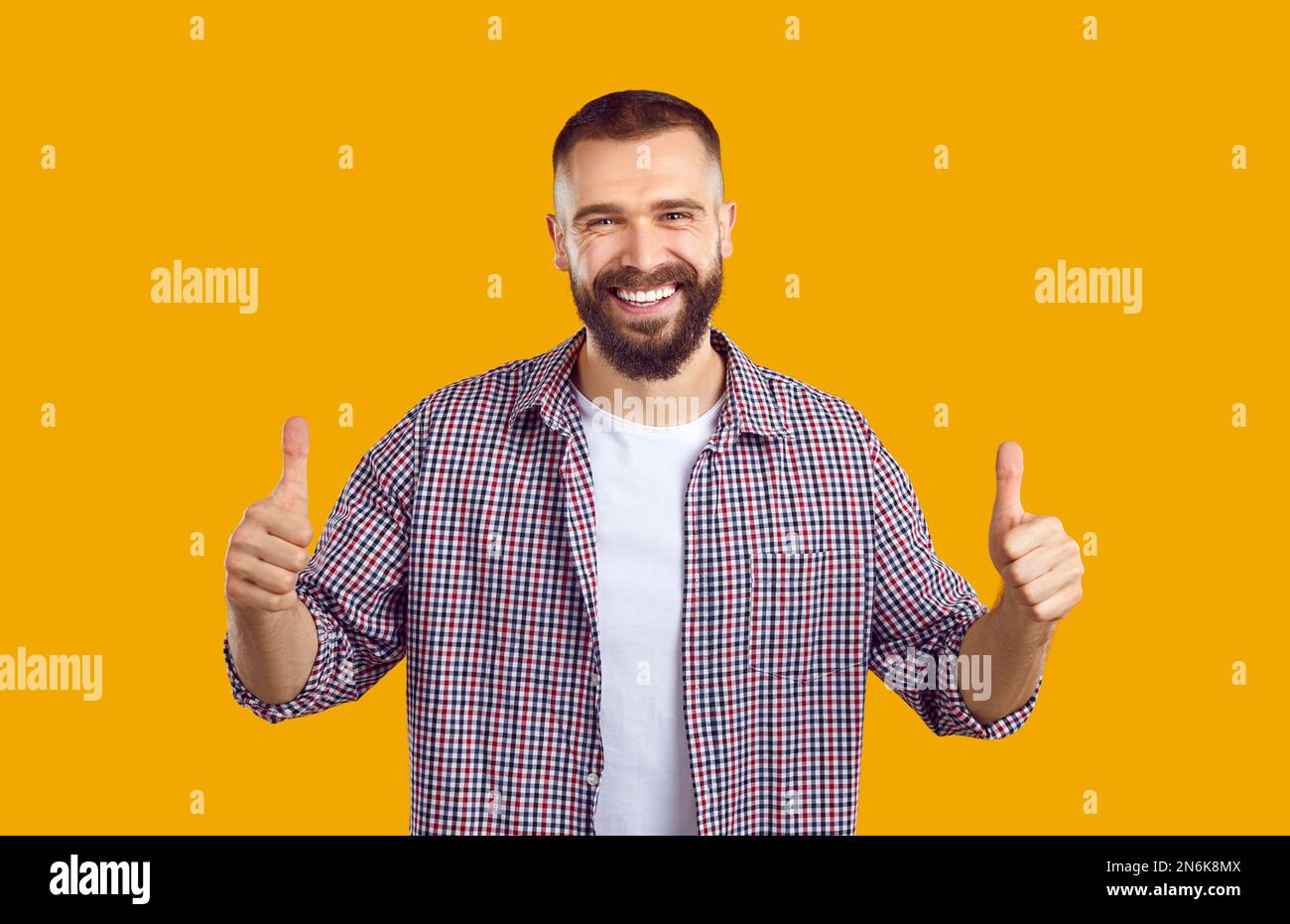 Joyful man approving, making positive hand gesture, smiling and ...