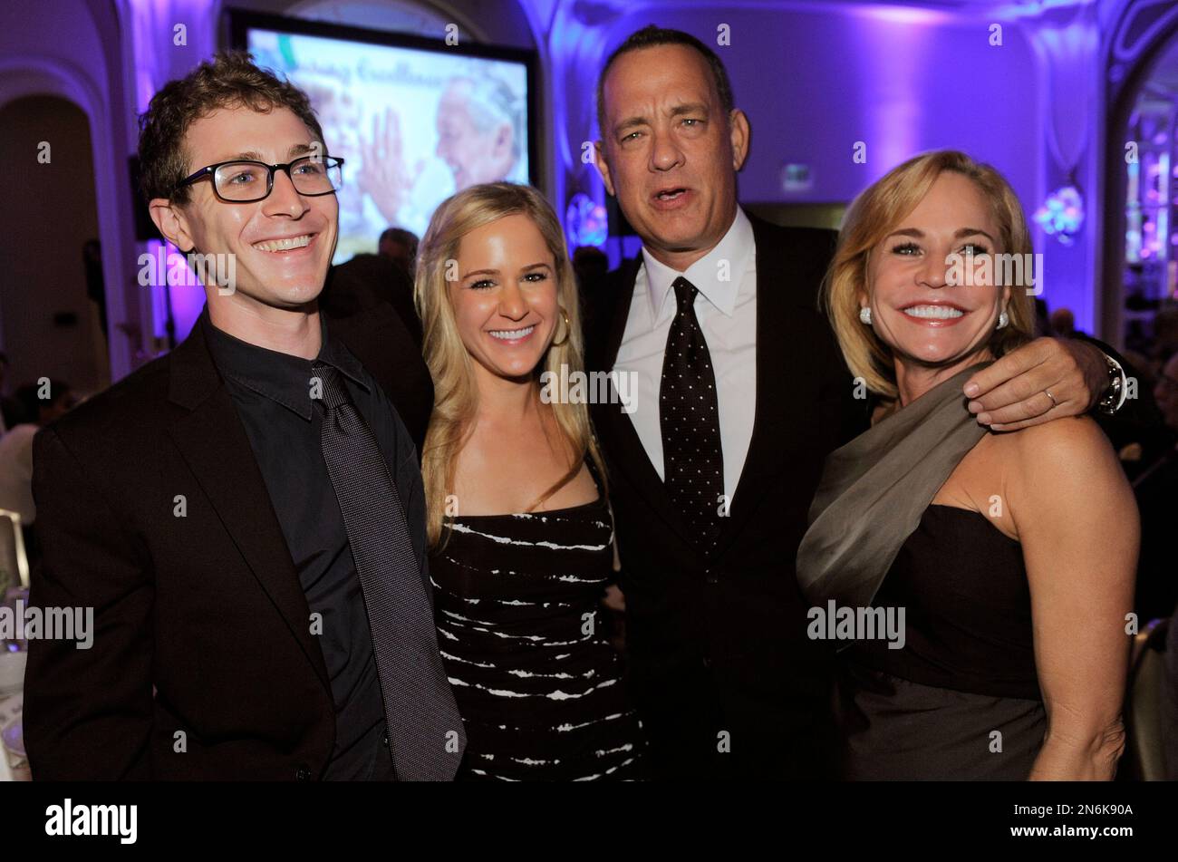 Host Tom Hanks, second from right, poses with Michael Rimoin, far left ...