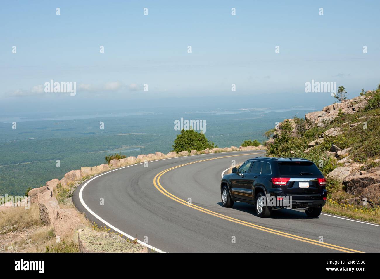 Car driving up Cadillac Mountain drive in Acadia national park, Maine ...