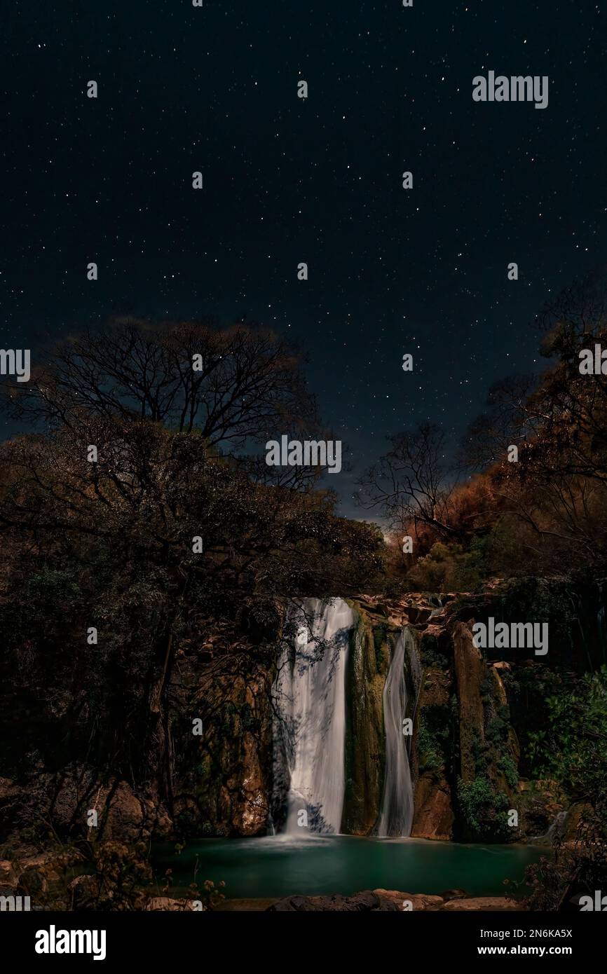 A landscape of Comala waterfalls in Cascada de Comala Park at sunset in ...