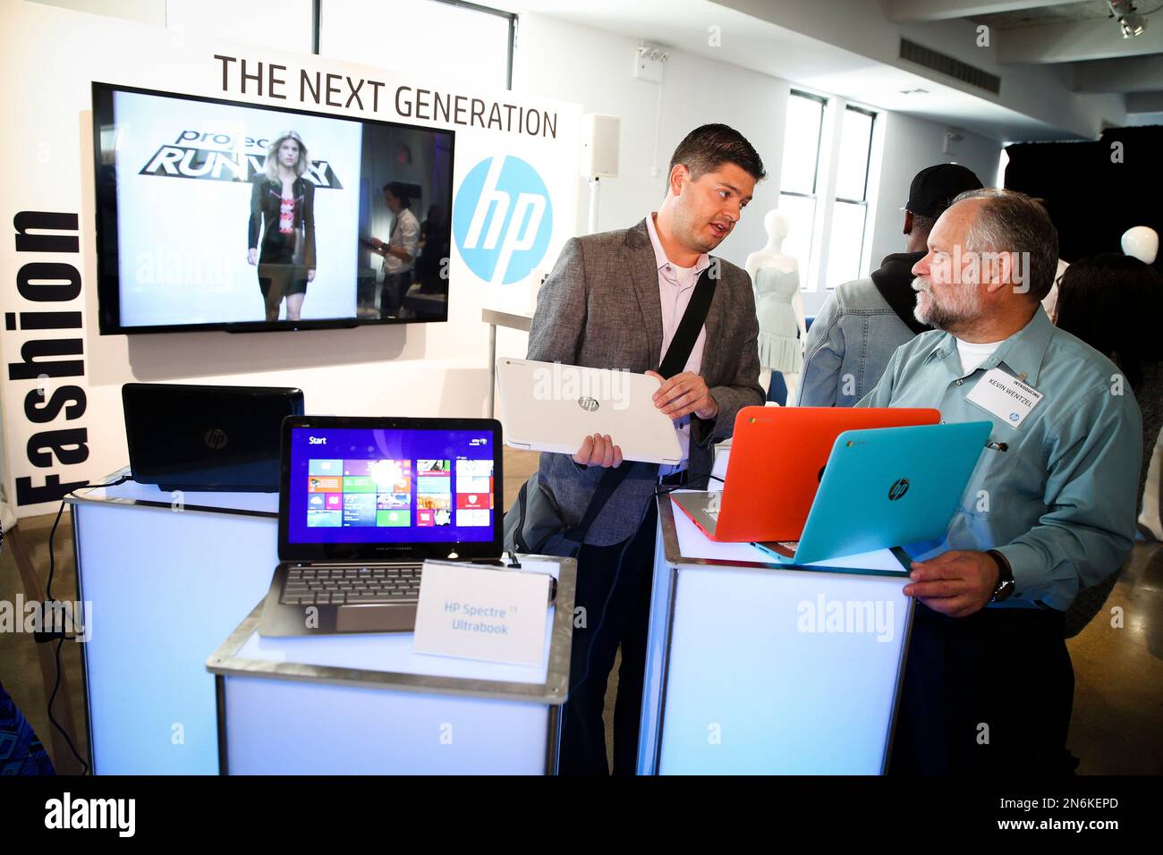 A guest handles an HP Spectre13 Ultrabook during the HP Next Generation ...