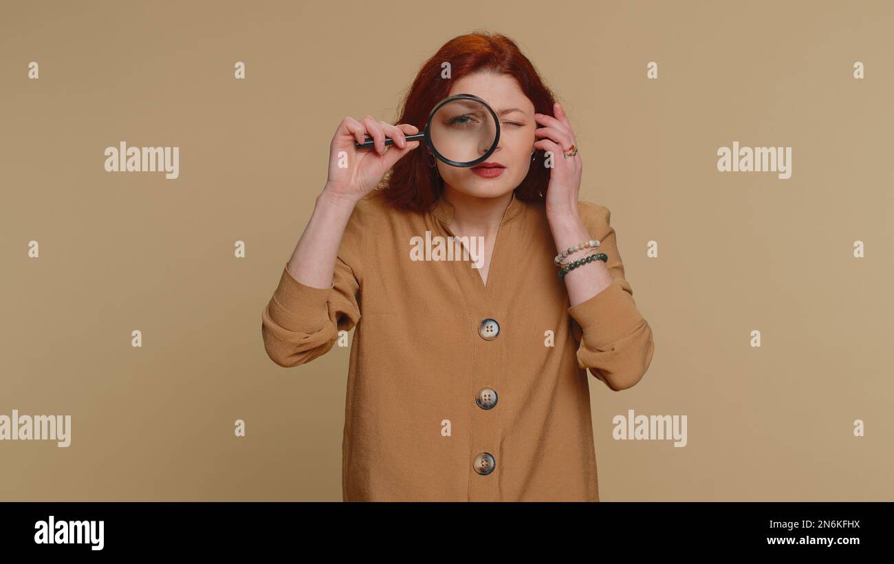 Investigator researcher scientist woman holding magnifying glass near ...