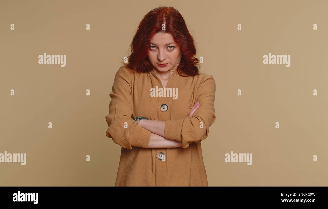 Dissatisfied redhead woman asking reason of failure, expressing ...