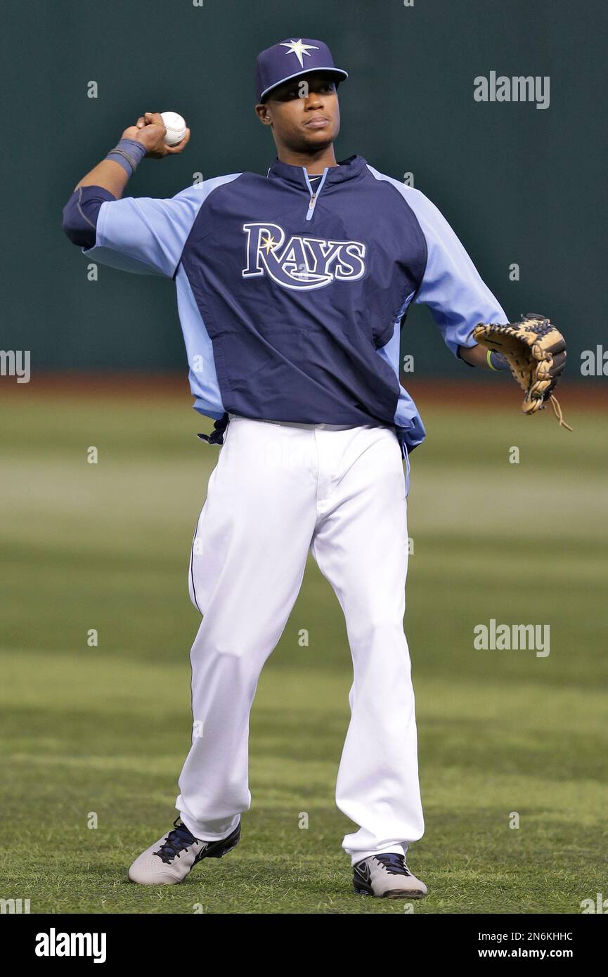 Tampa Bay Rays infielder Tim Beckham throws the ball before a baseball ...