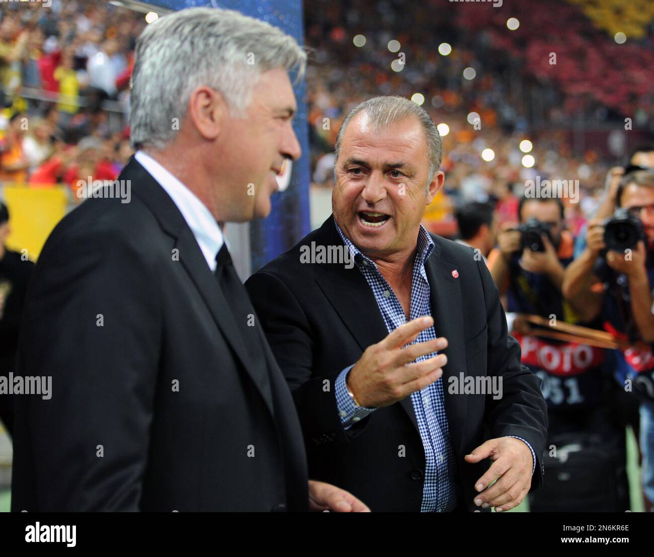 Galatasaray's coach Fatih Terim, right, with Real Madrid's coach Carlo ...