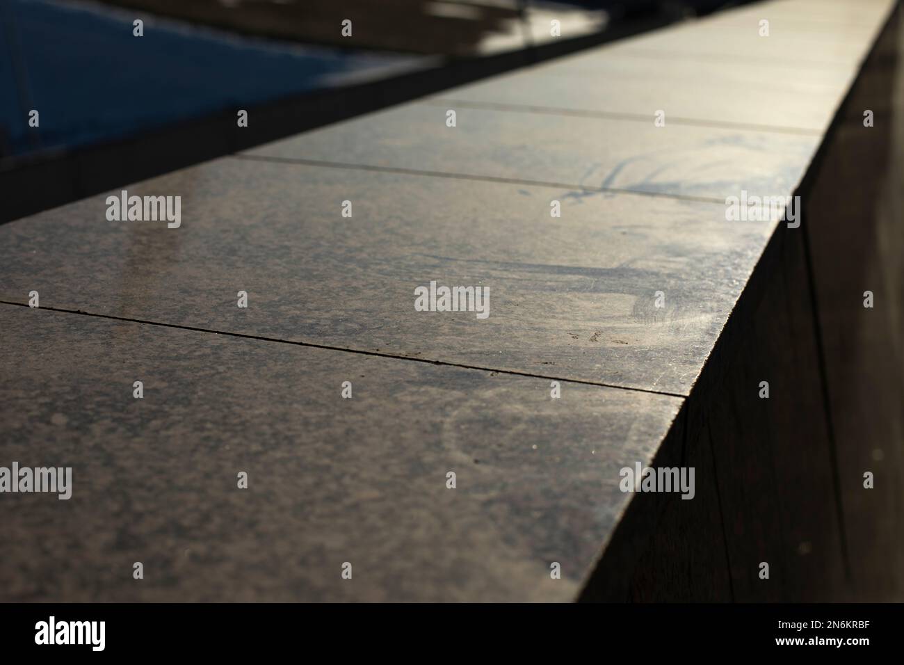 Granite tiles. Facade cladding. Details of building. Parapet in city ...