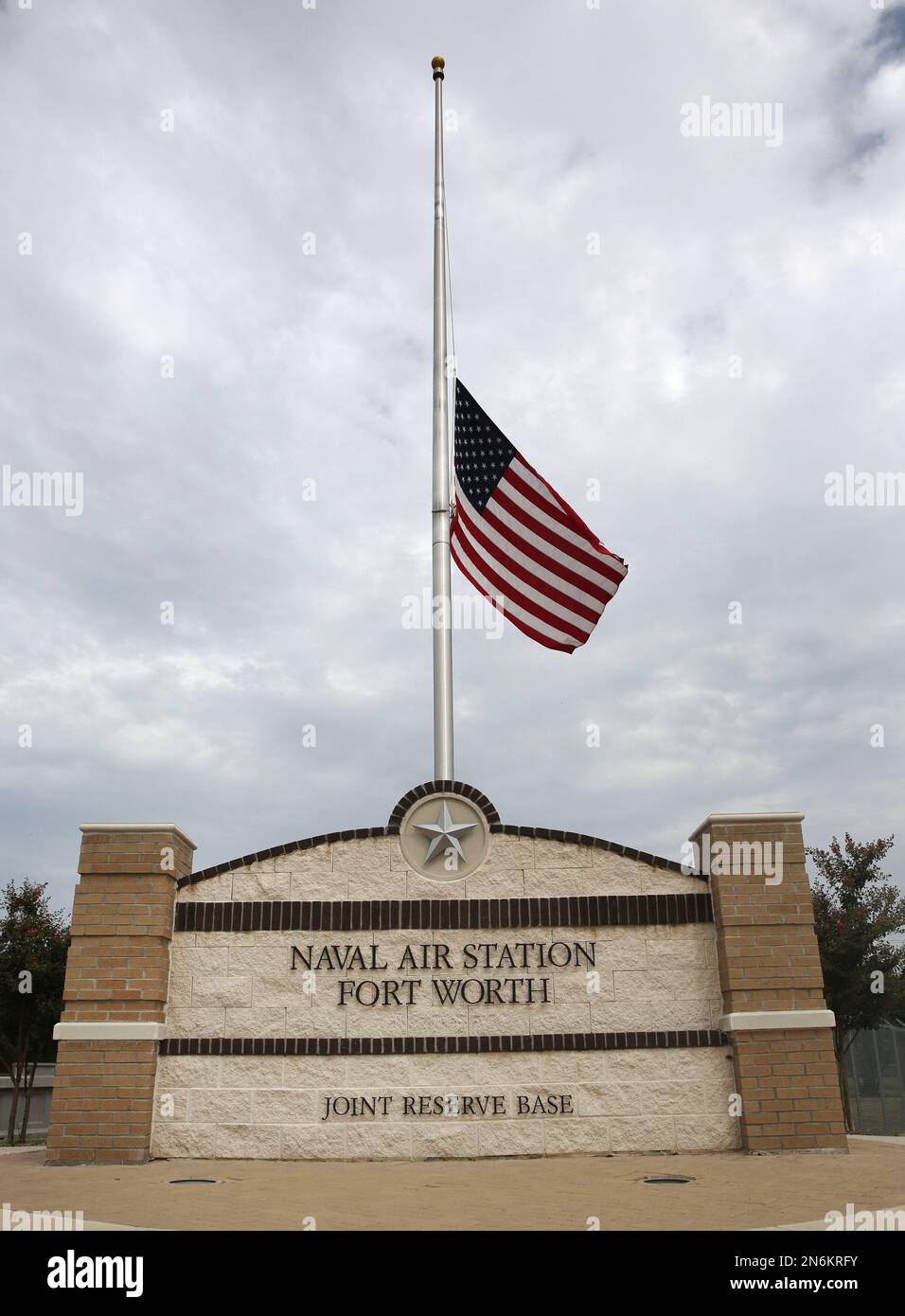 The flag flies at half-staff at the front entrance of the Naval Air ...