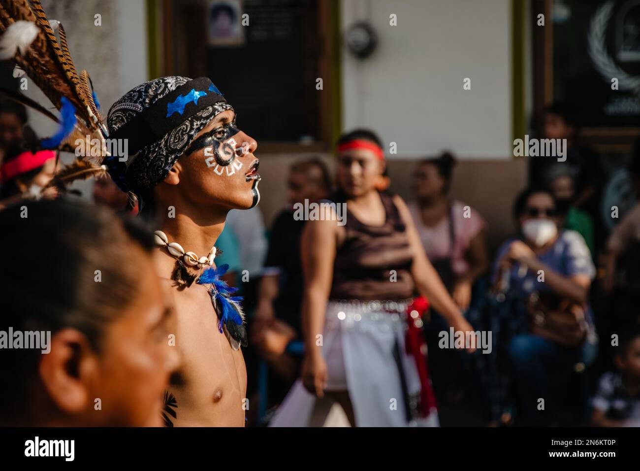 A male with traditional customs and native american headdress during ...