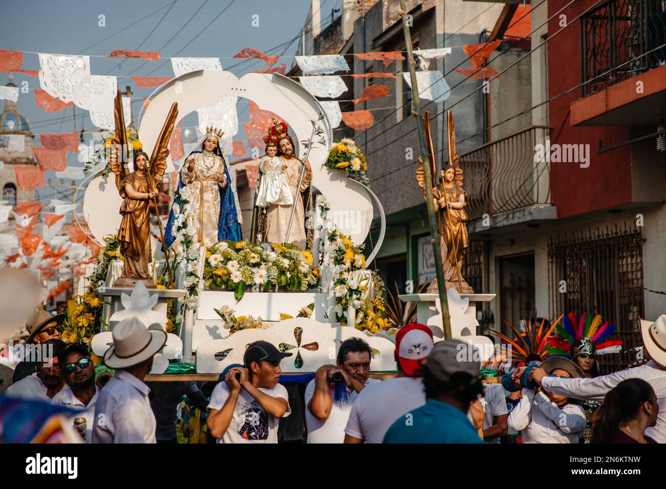 People carry a Jesus statue and the virgin mary during the annual ...