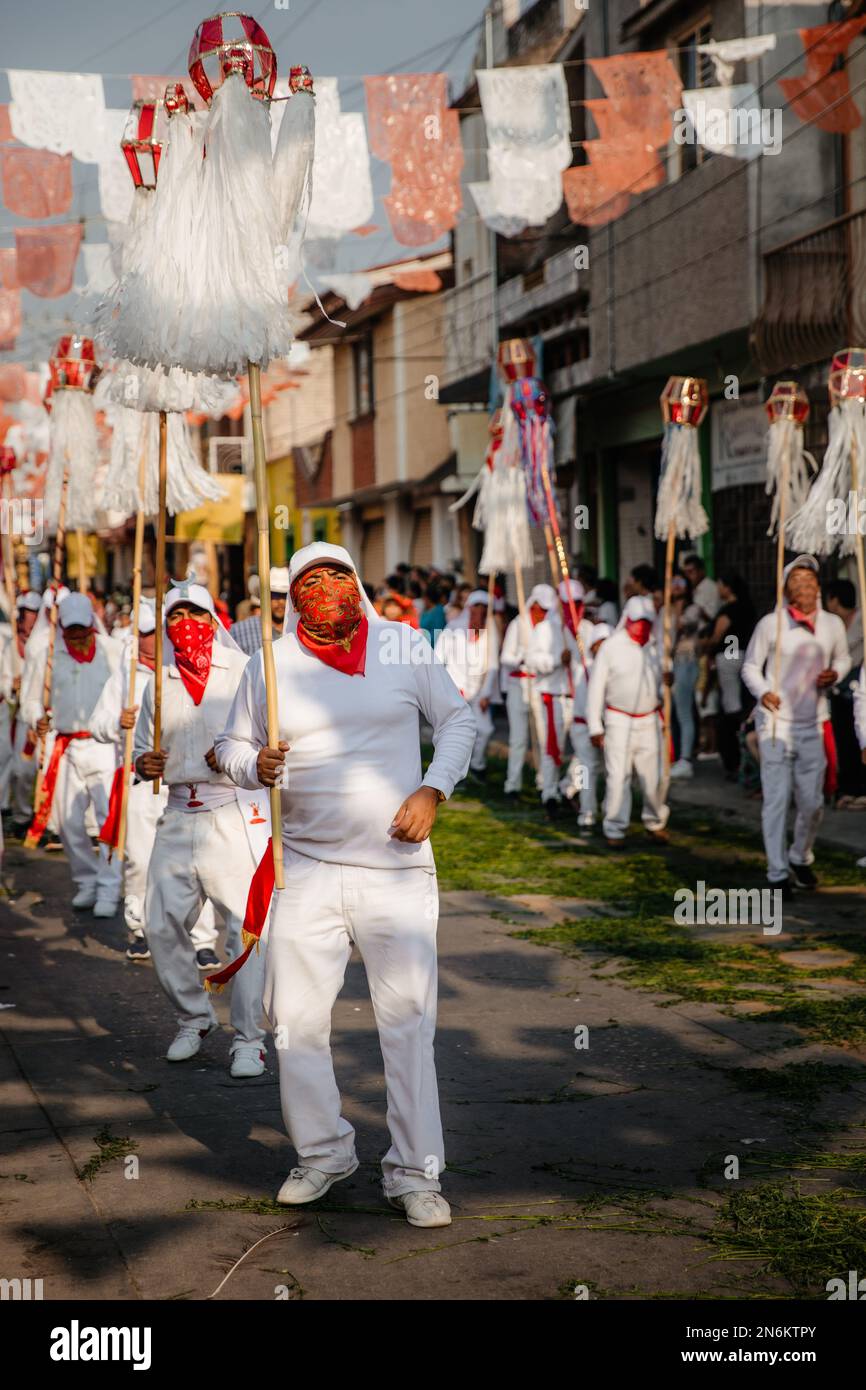 A group of people in traditional customs perform street show at the ...