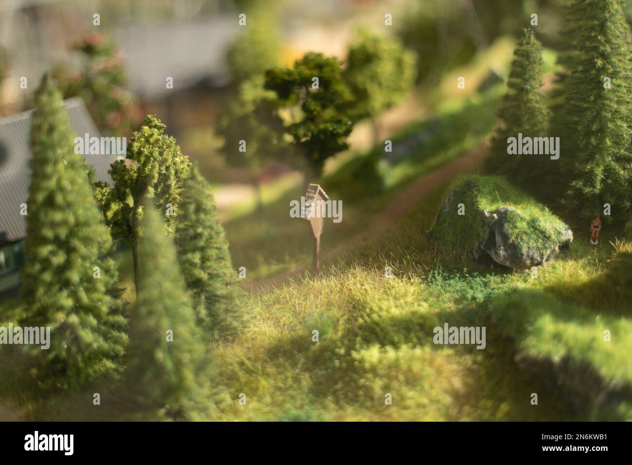 Model of mountainous area. Miniature trees in toy park. Mountain ...