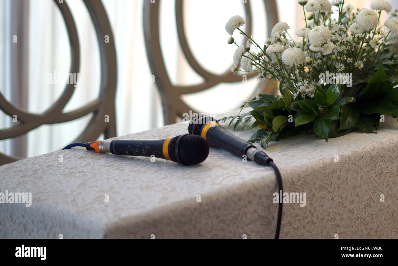 microphones on table for wedding procession Stock Photo - Alamy