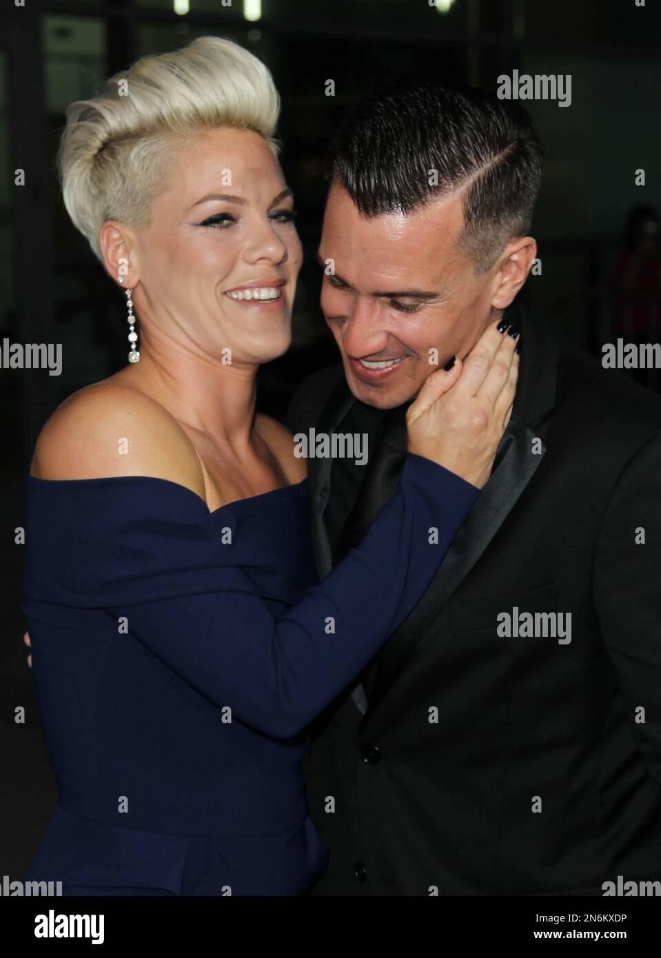Alecia Moore aka Pink, left, and Carey Hart arrive at the premiere of ...