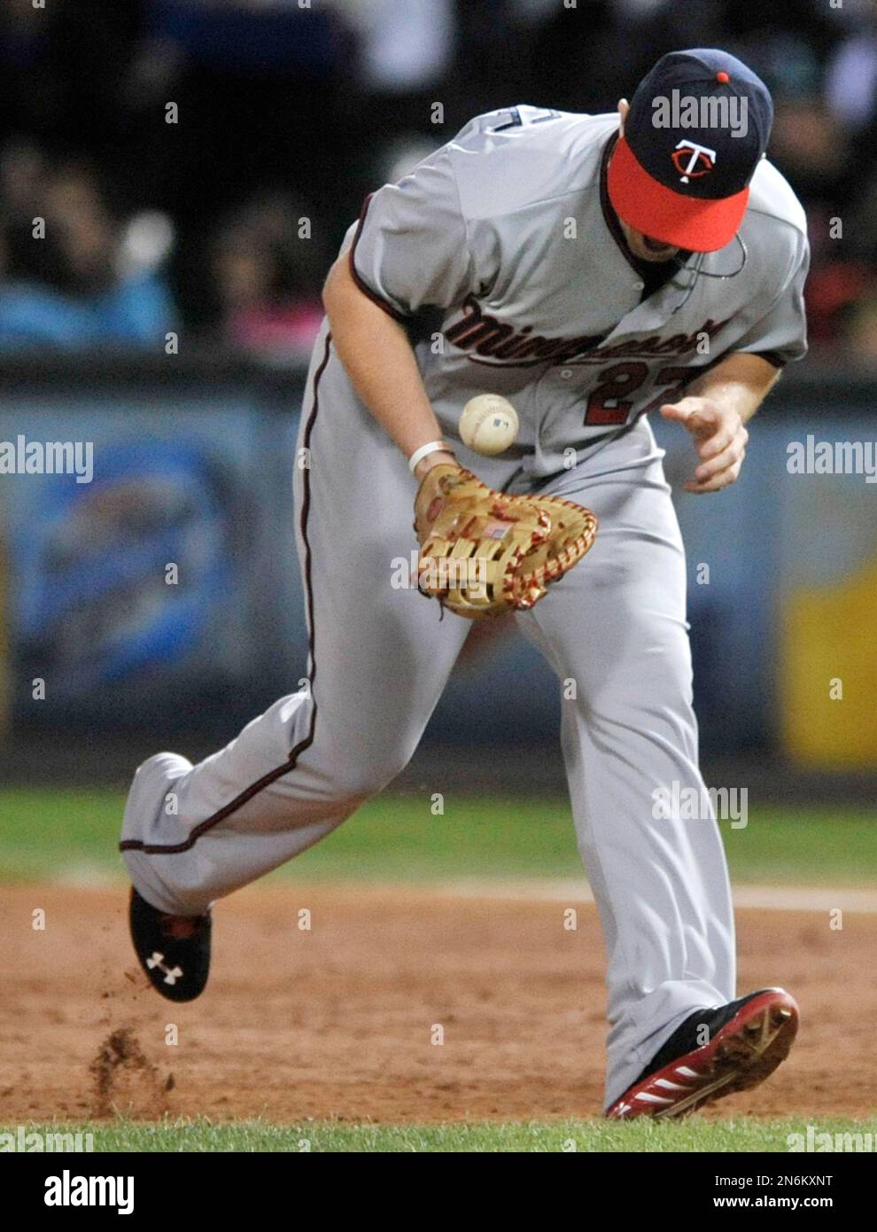 Minnesota Twins first baseman Chris Parmelee drops a grounder hit by ...