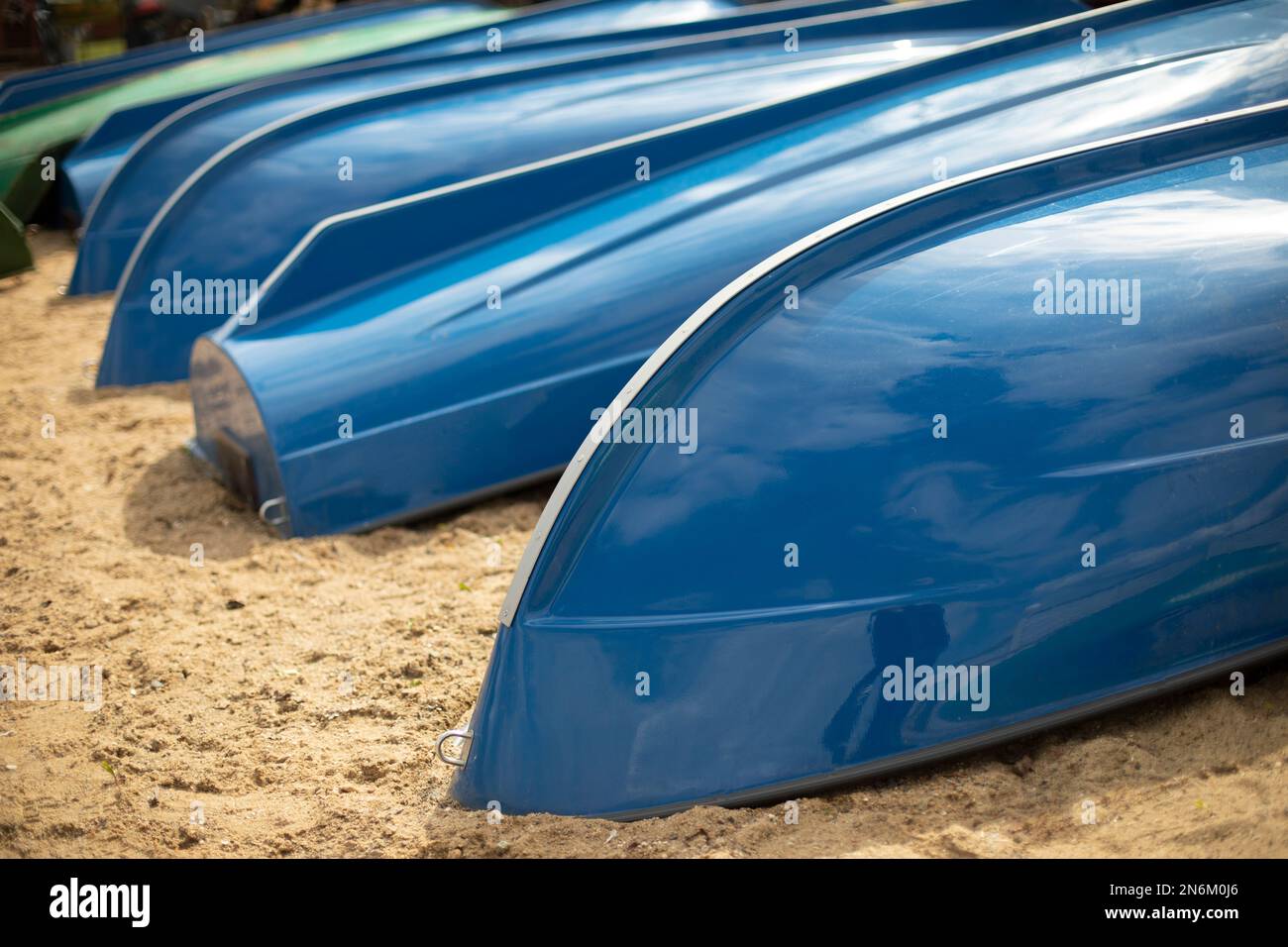 Blue boats on beach. Boat station on lake. Boats dry up on shore Stock ...