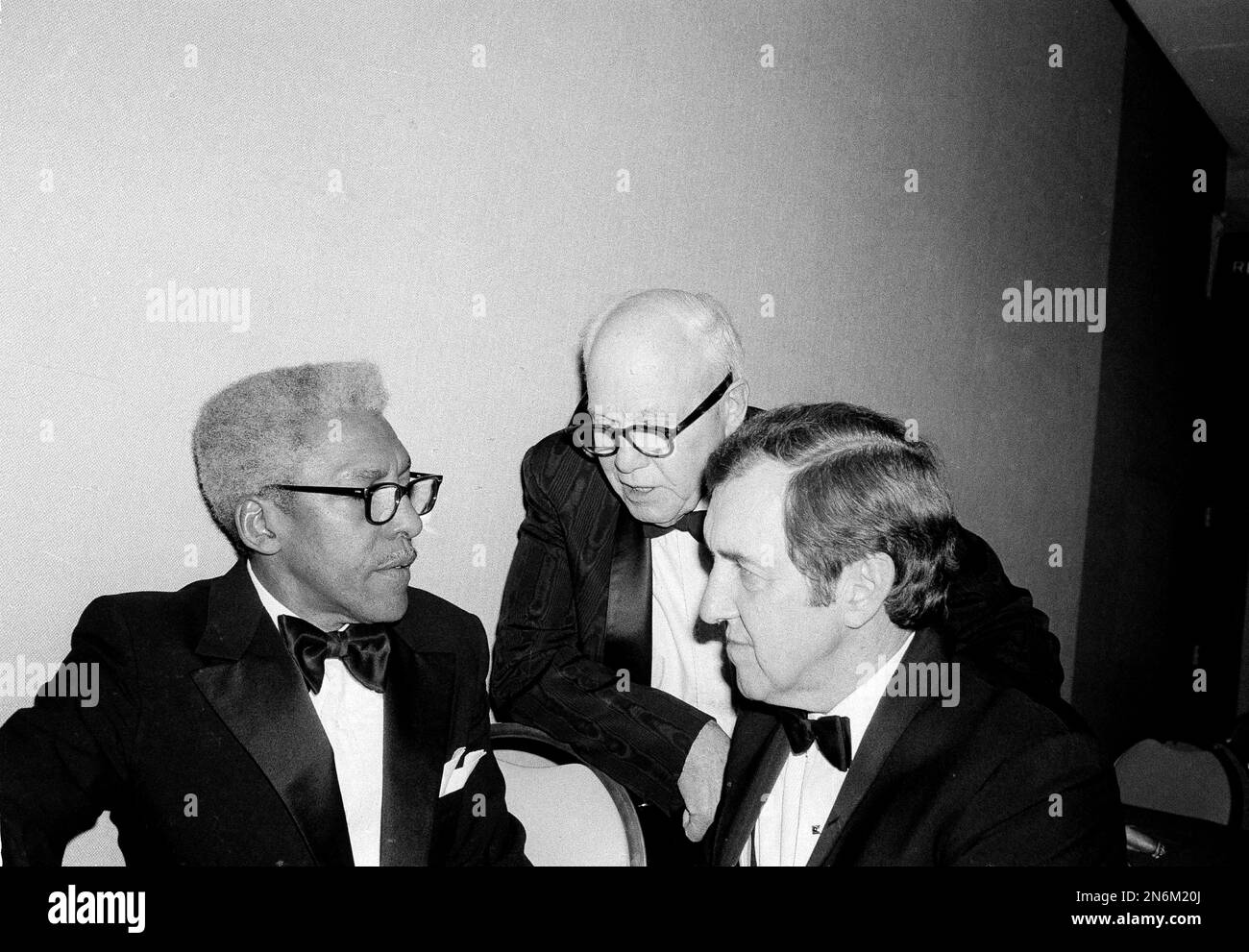 Chatting at a testimonial dinner for civil rights leader Bayard Rustin ...