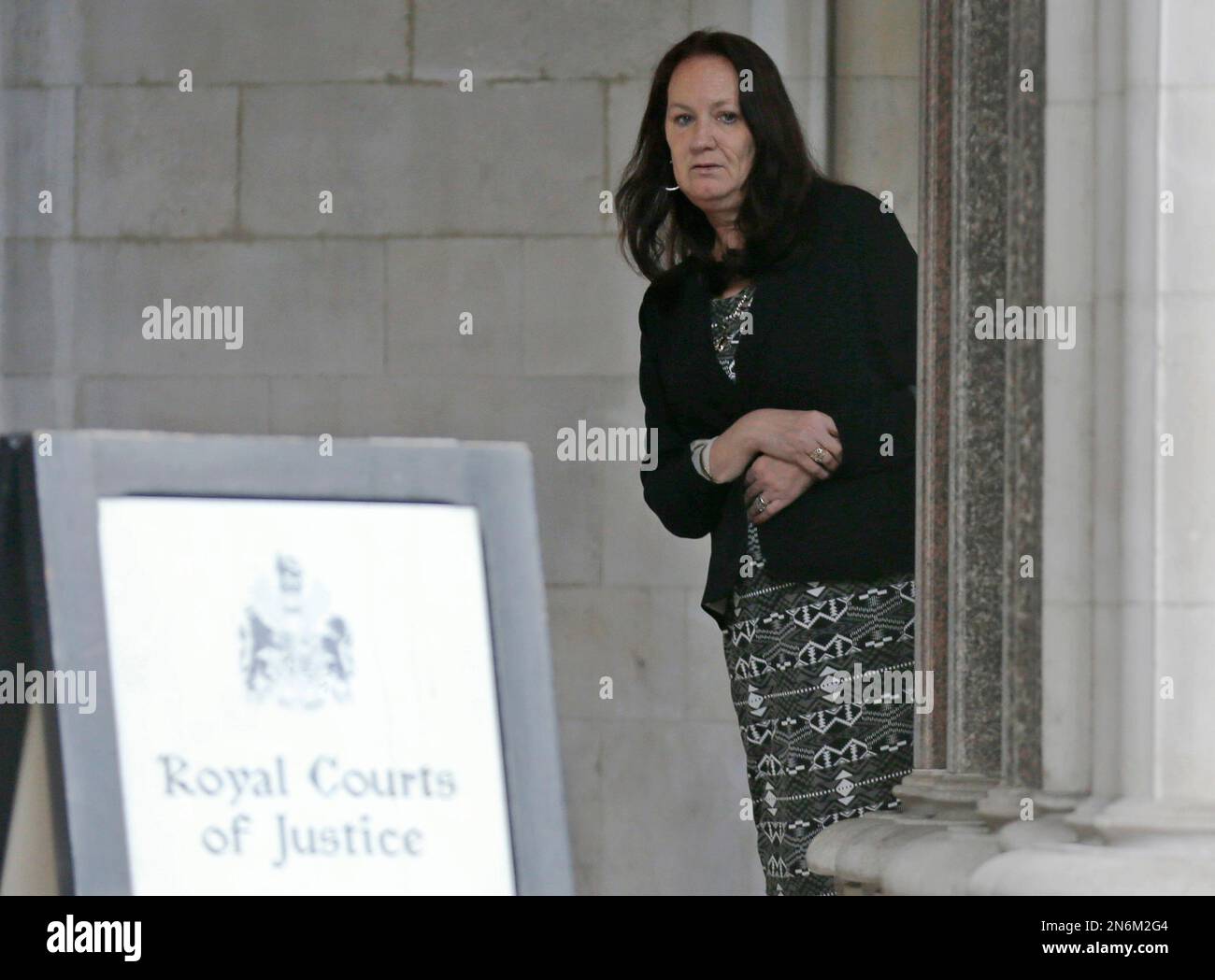 Pam Duggan, mother of Mark Duggan, looks on during a break from the ...