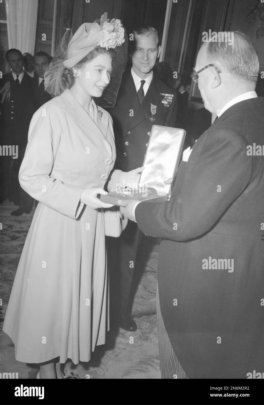 Britain's Princess Elizabeth receives the Insignia of the Grand Cordon ...