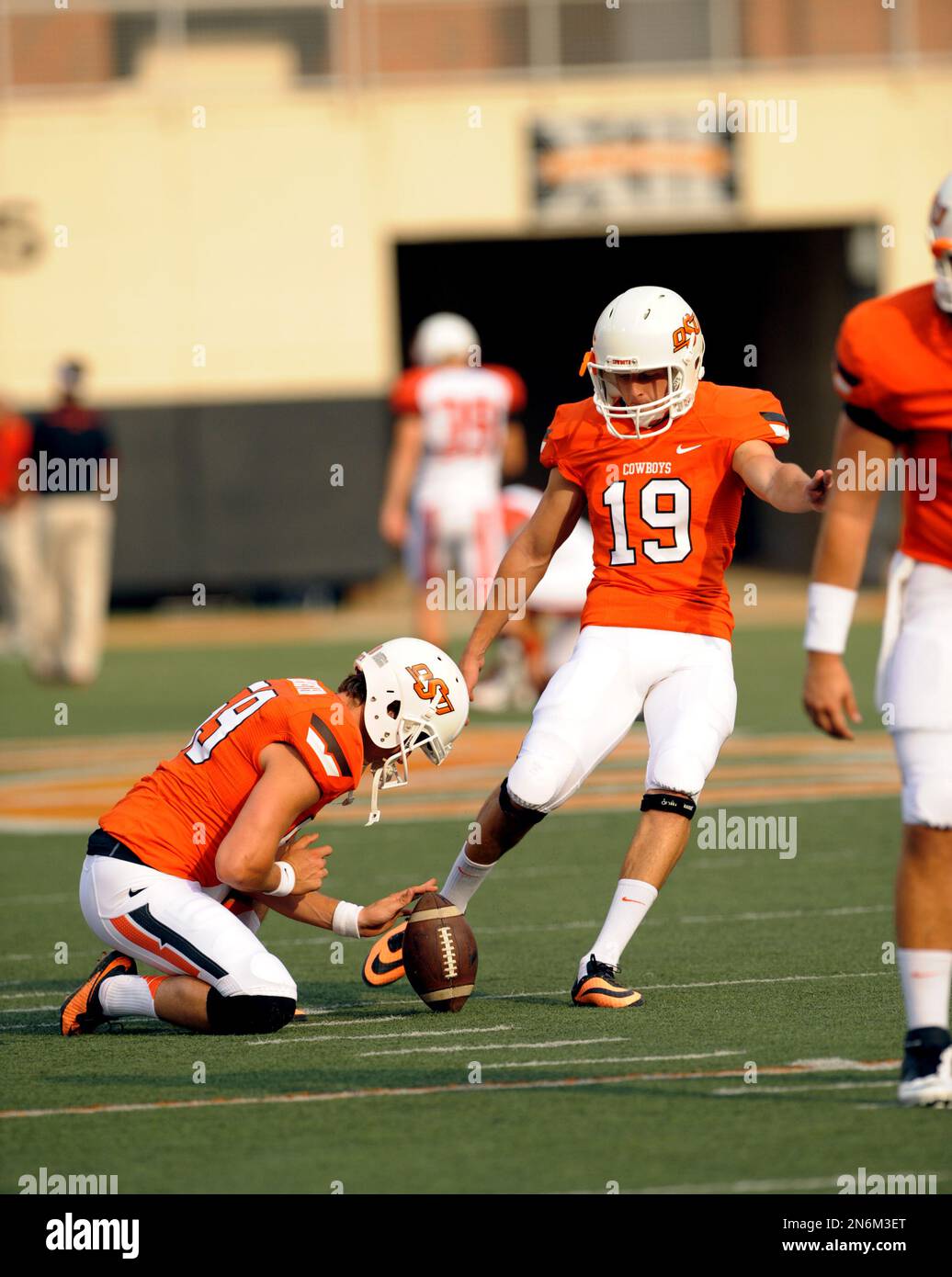 Oklahoma State holder Michael Reichenstein and kicker Ben Grogan warm ...