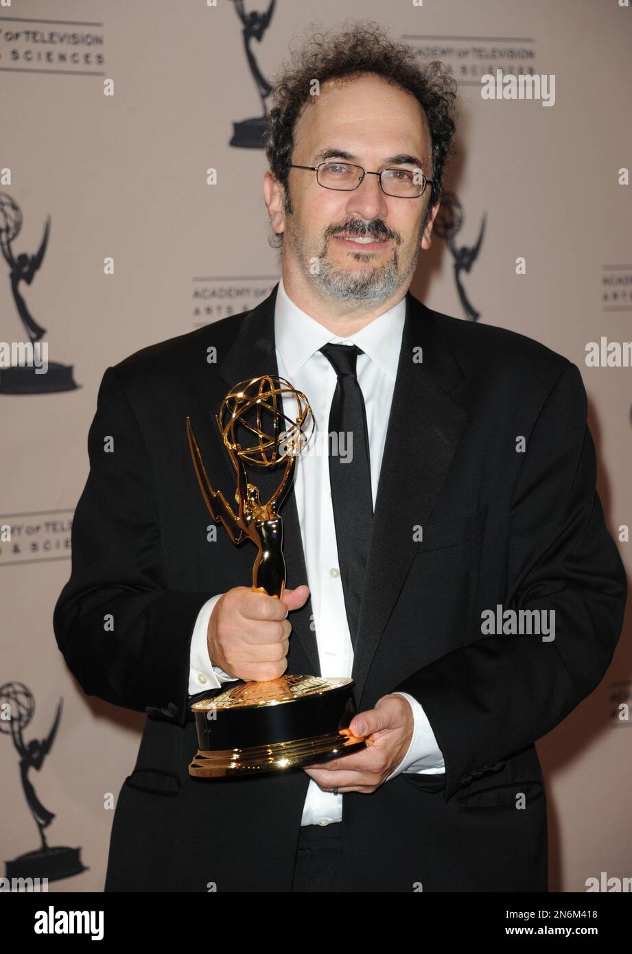 Robert Smigel poses backstage with the award for outstanding ...