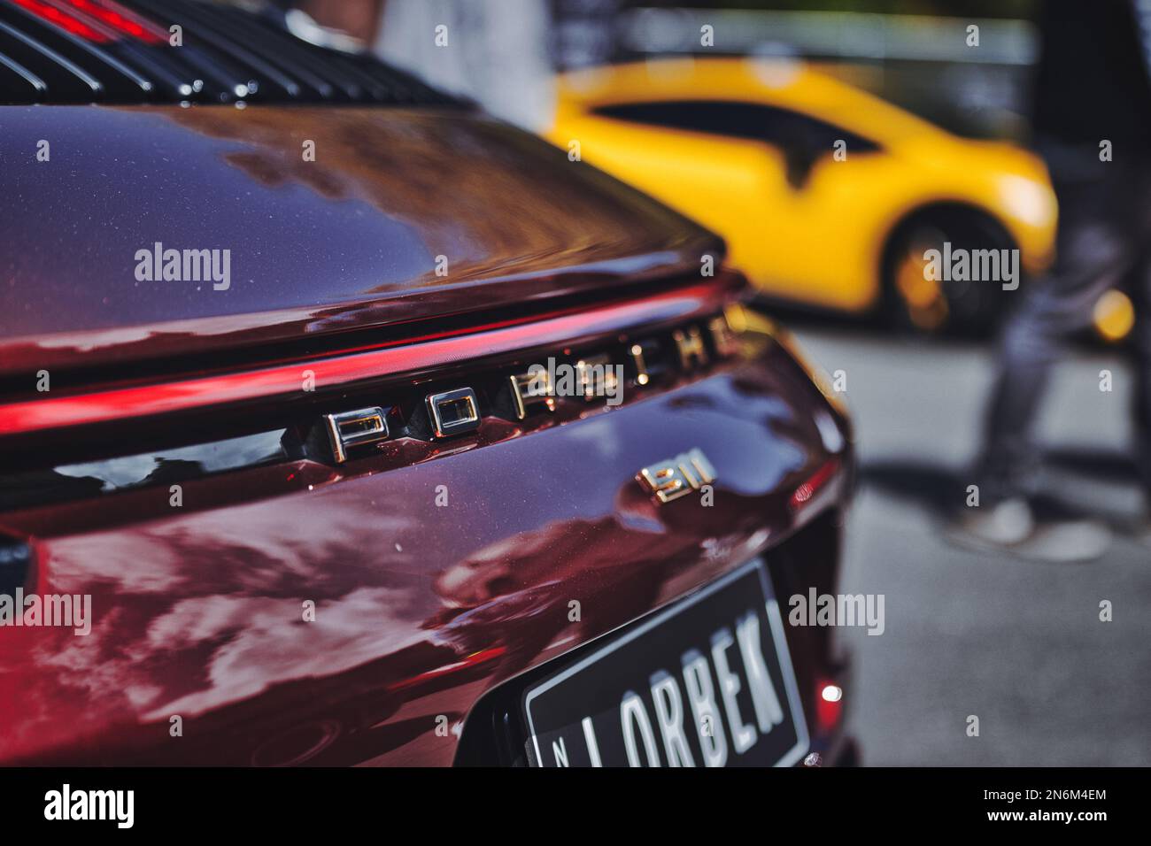A closeup of the backside of red Porsche 911 Targa supercar with a ...