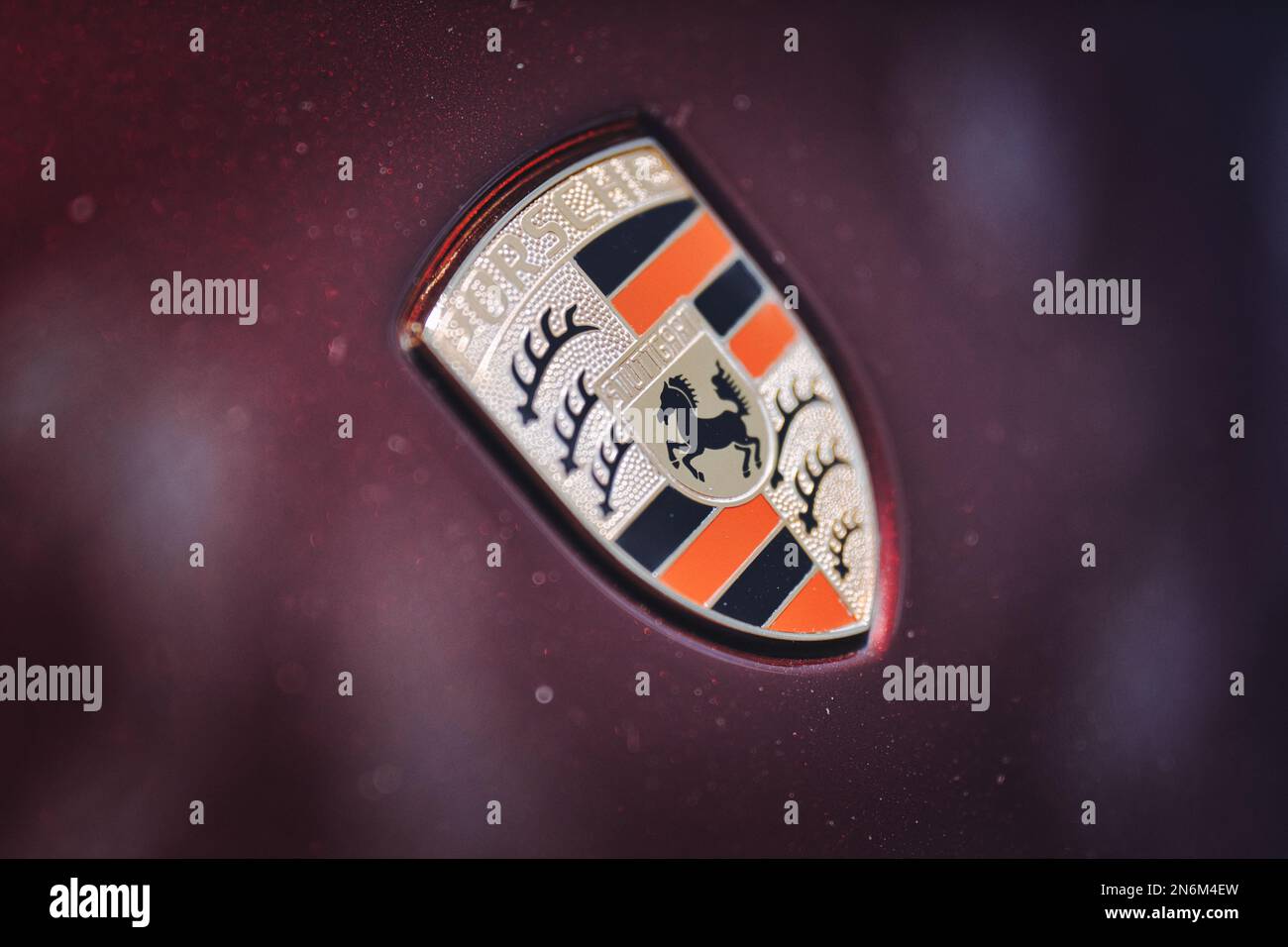 A macro shot of the logo of the red Porsche 911 Targa supercar Stock ...