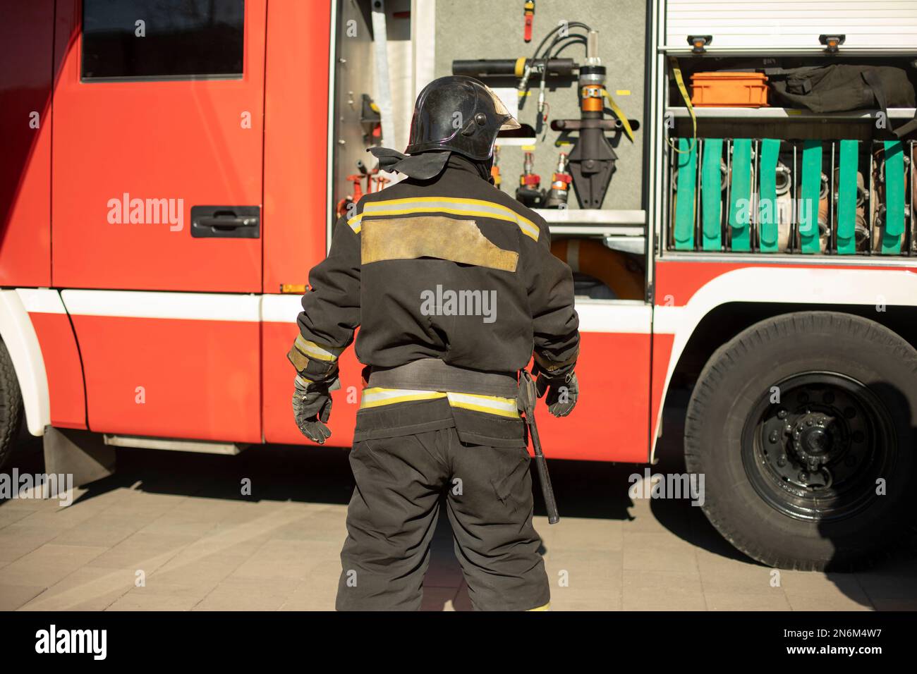 Firefighter at work. Lifeguard near car. Fire service vehicle Stock ...