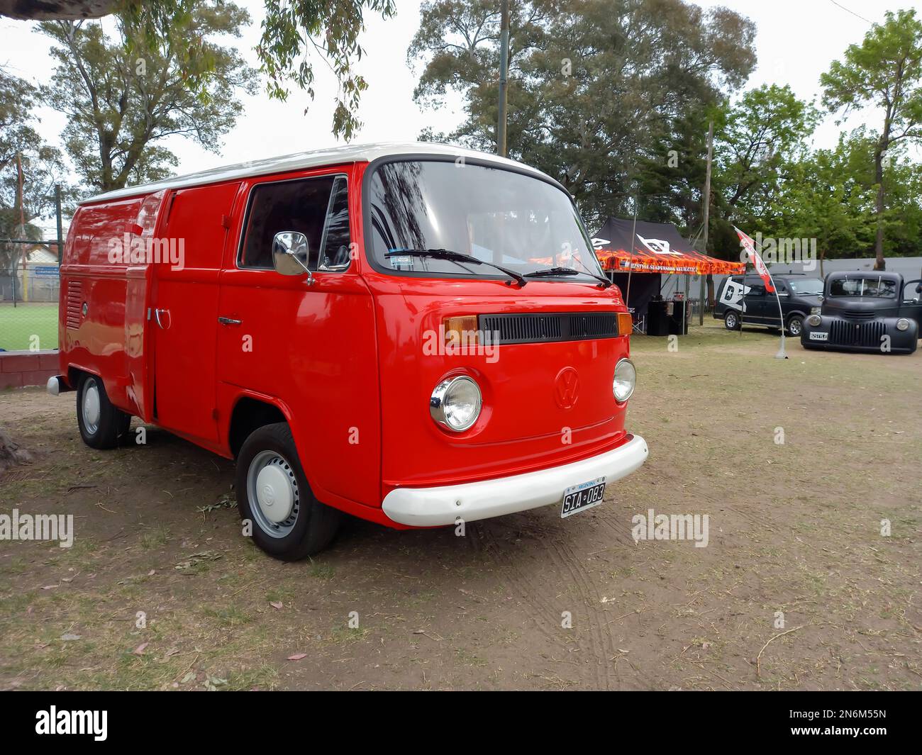 red 1970s Volkswagen Type 2 T2 Transporter panel delivery van in a park ...