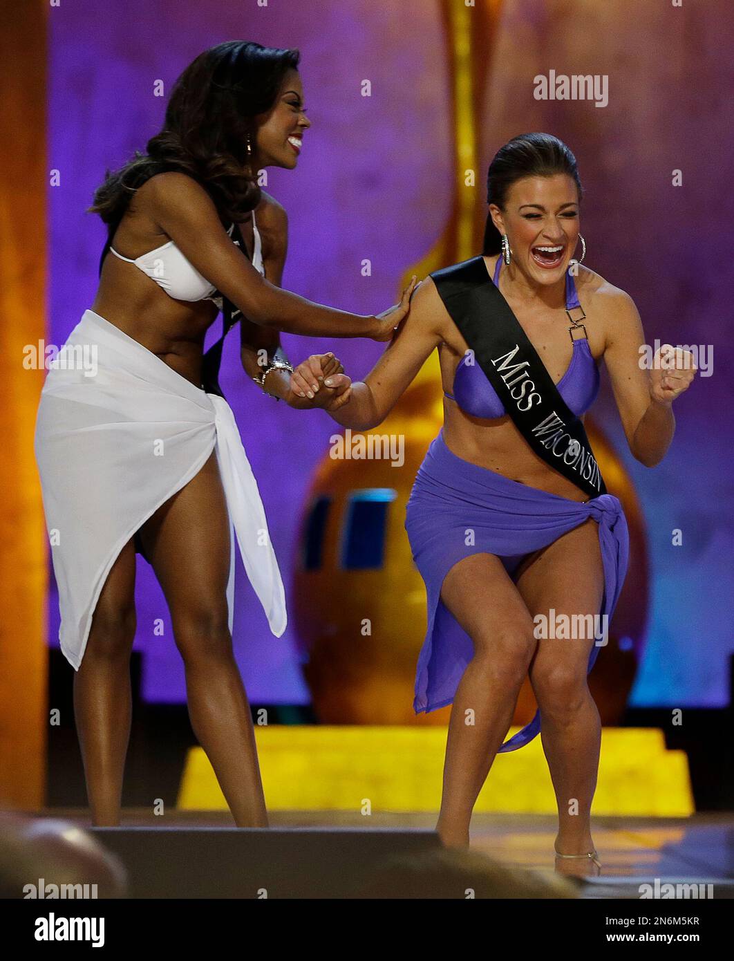 Miss Wisconsin Paula Mae Kuiper, right, reacts after finding out she's advancing beyond the ...