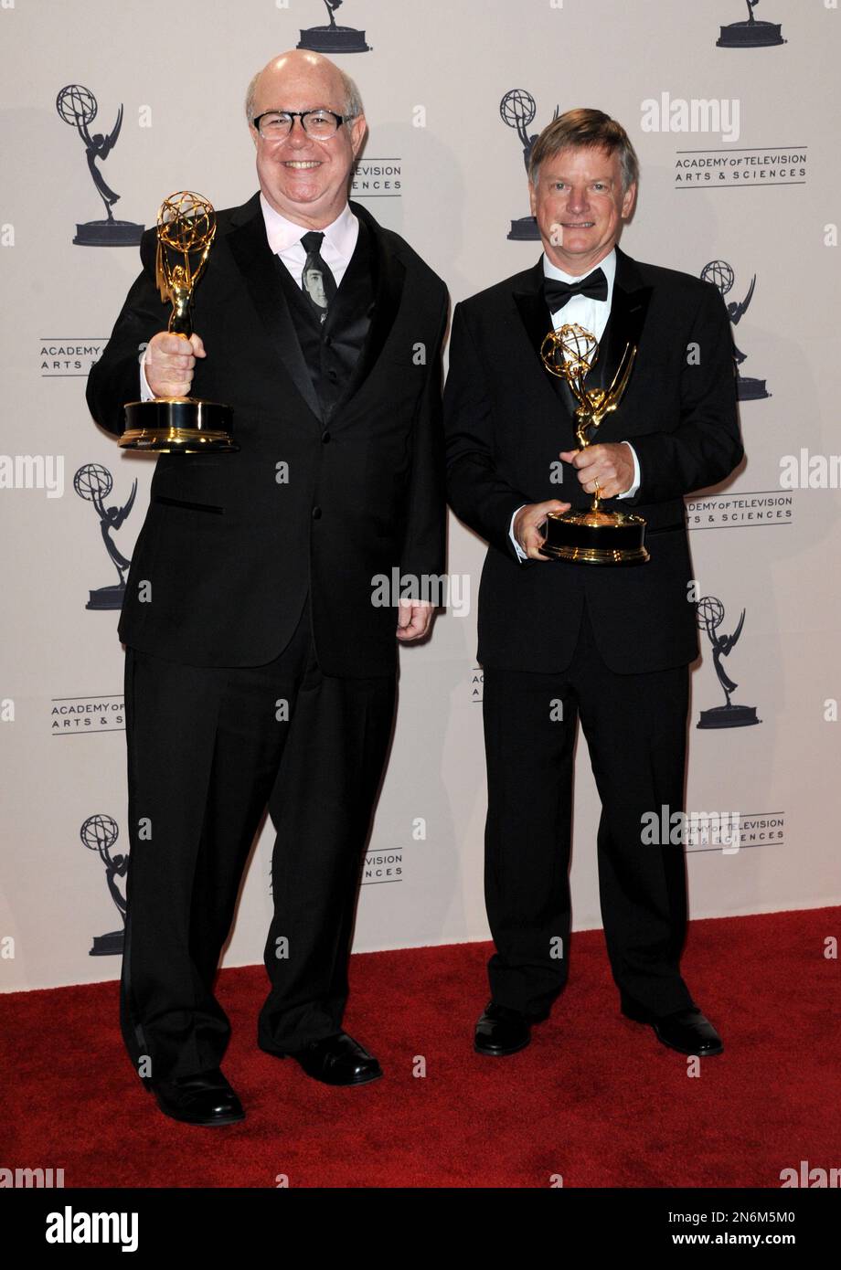 Larry Blake, left, and Dennis Towns, right pose backstage with their ...
