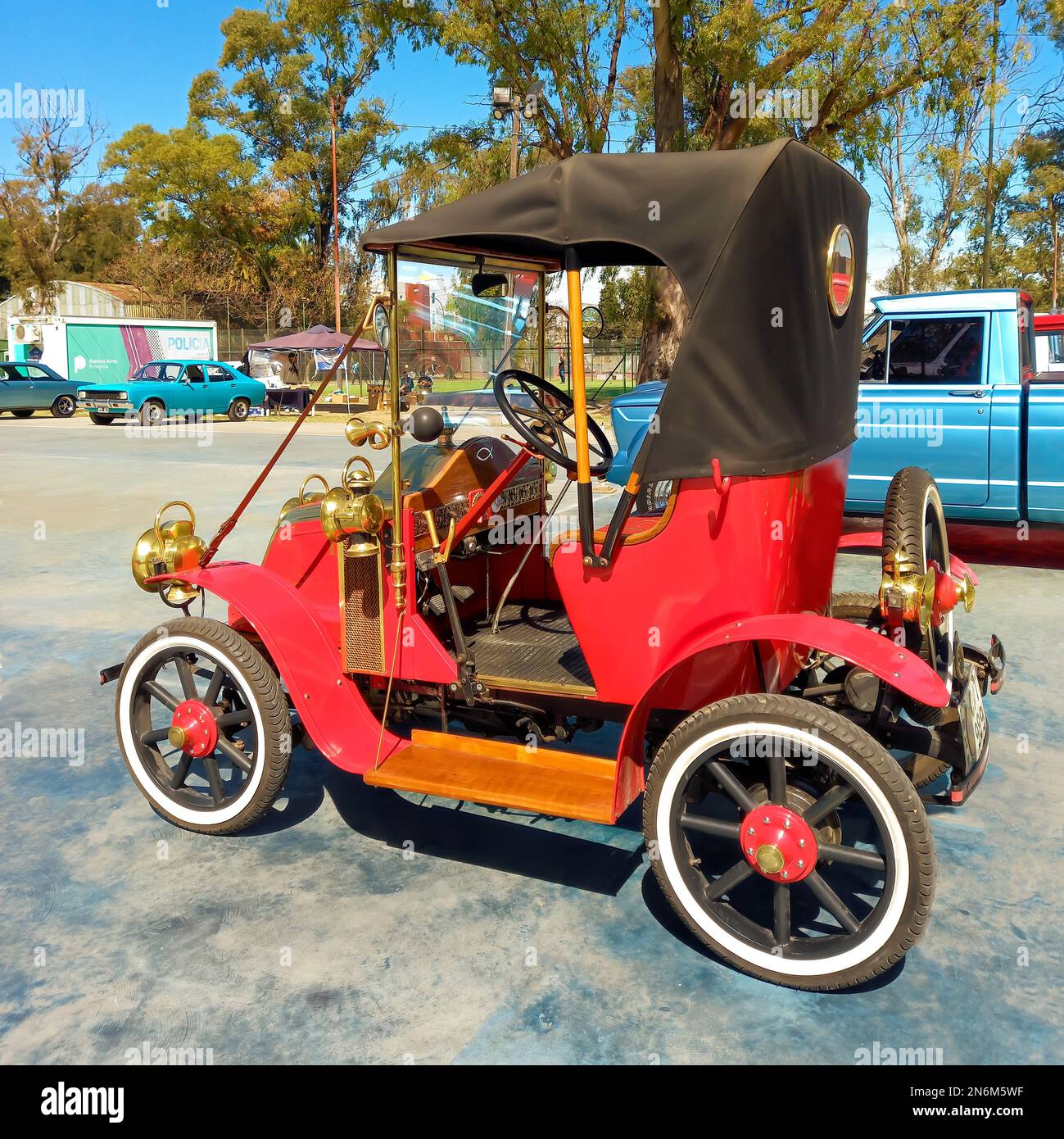 Shot of an antique old red 1907 Renault roadster in a park. AAA 2022 ...