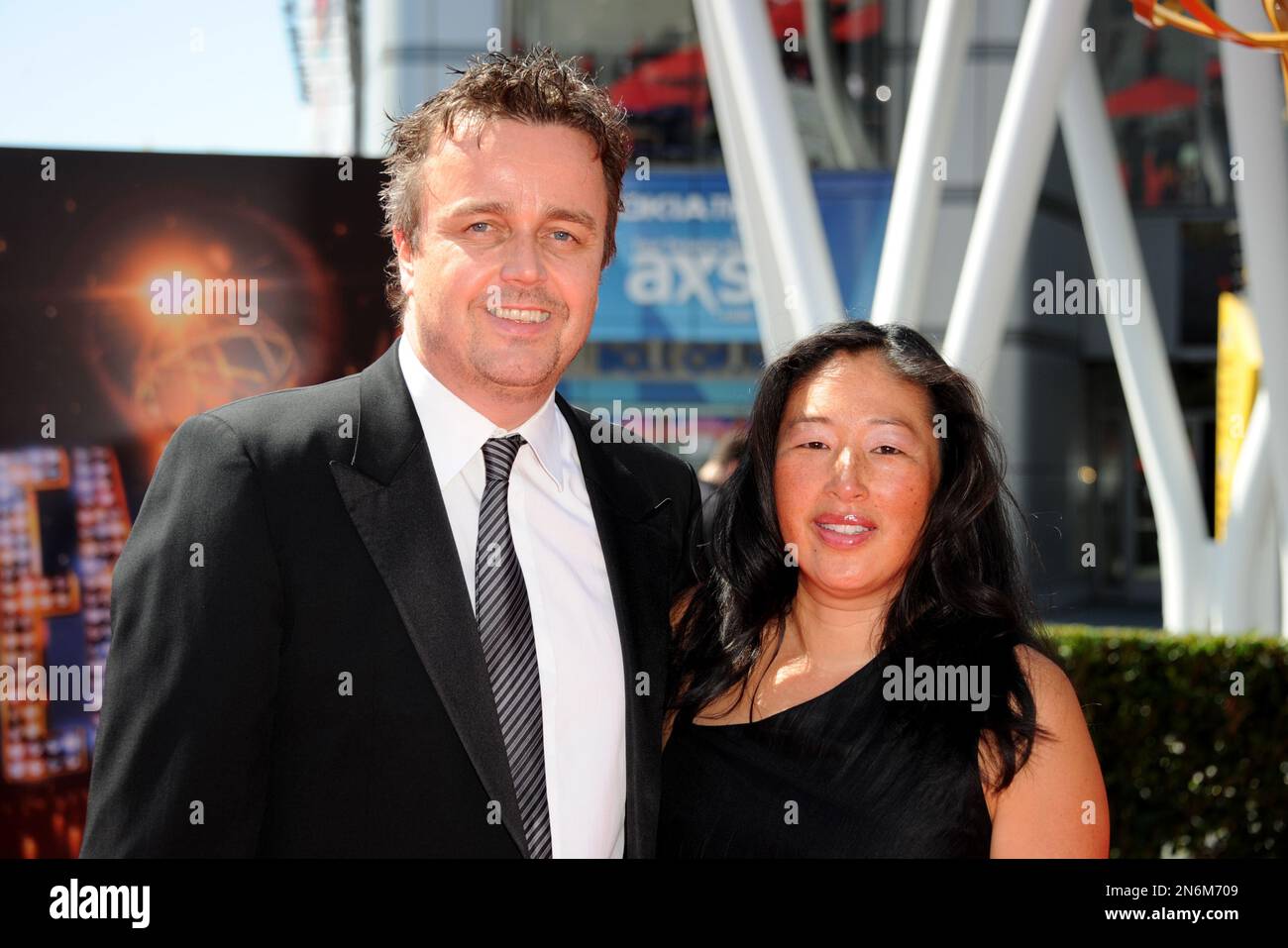 Composer Sean Callery, left, and Debbie Dao arrives at the Primetime ...