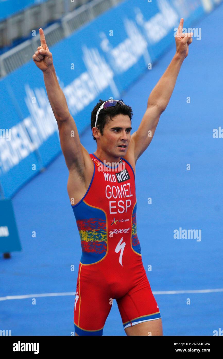 Javier Gomez of Spain celebrates his race win and his world triathlon ...
