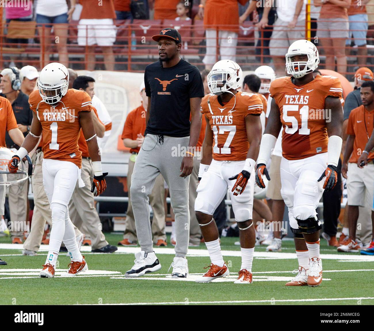 Former Texas basketball player, Kevin Durant (center left) walks onto ...