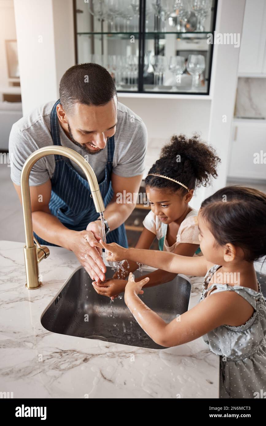 Love, father and girls washing hands, happiness and bonding together in ...