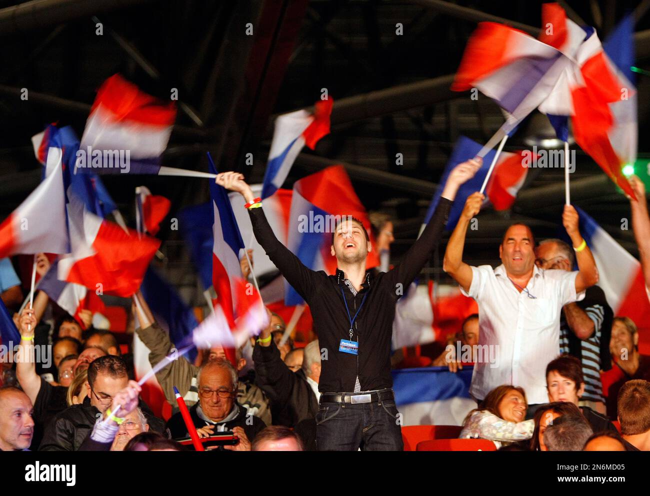 French far-right party members and supporters, wave flags during the ...