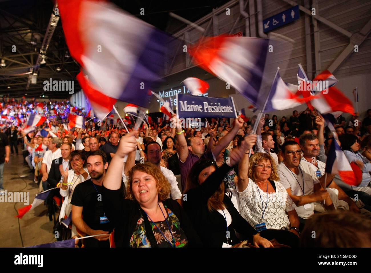 French far-right party members and supporters, wave flags during the ...