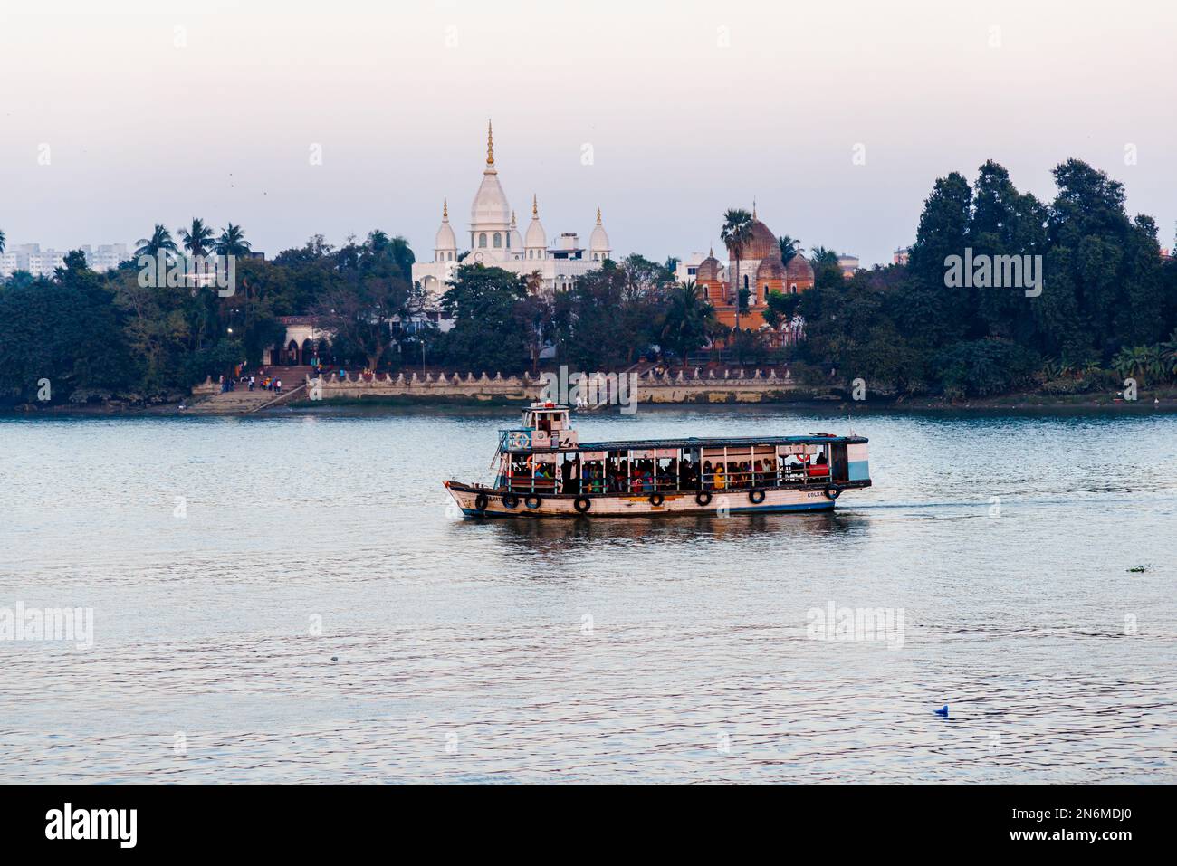 Local passenger ferry by ISKCON Panihati Hindu temple on the bank of ...