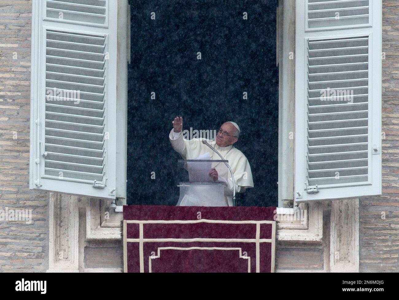 Pope Francis delivers his blessing during the Angelus noon prayer from ...