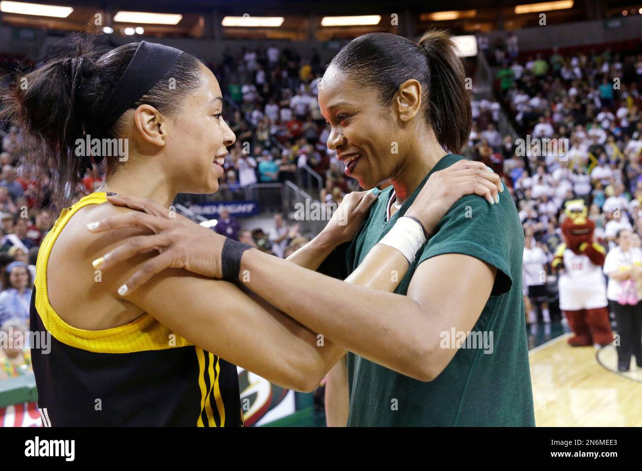 Seattle Storm's Tina Thompson, right, is greeted by Tulsa Shock's ...