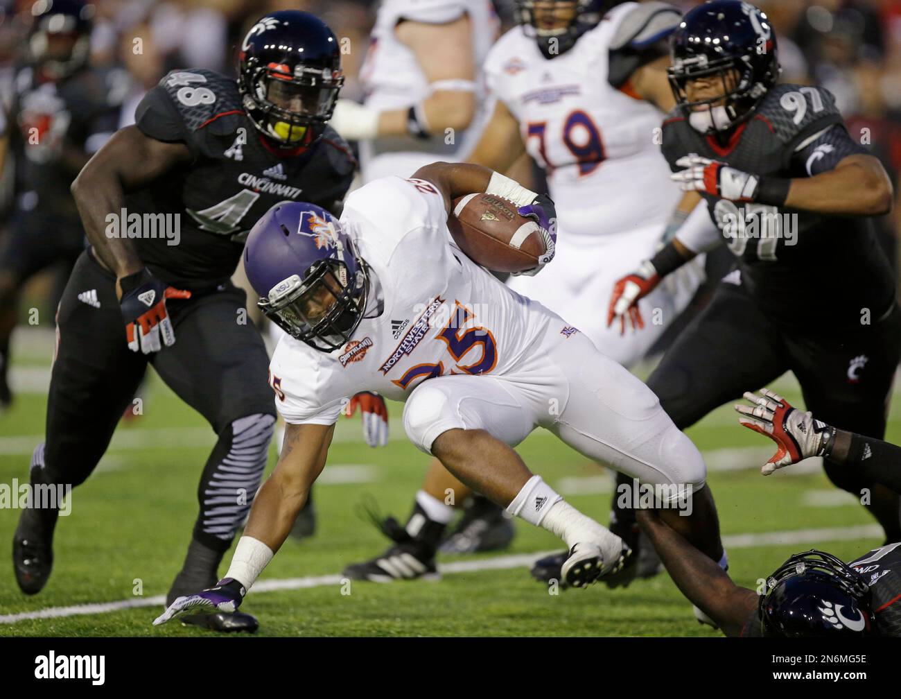 Northwestern State running back De'Mard Llorens (25) is pursued by ...