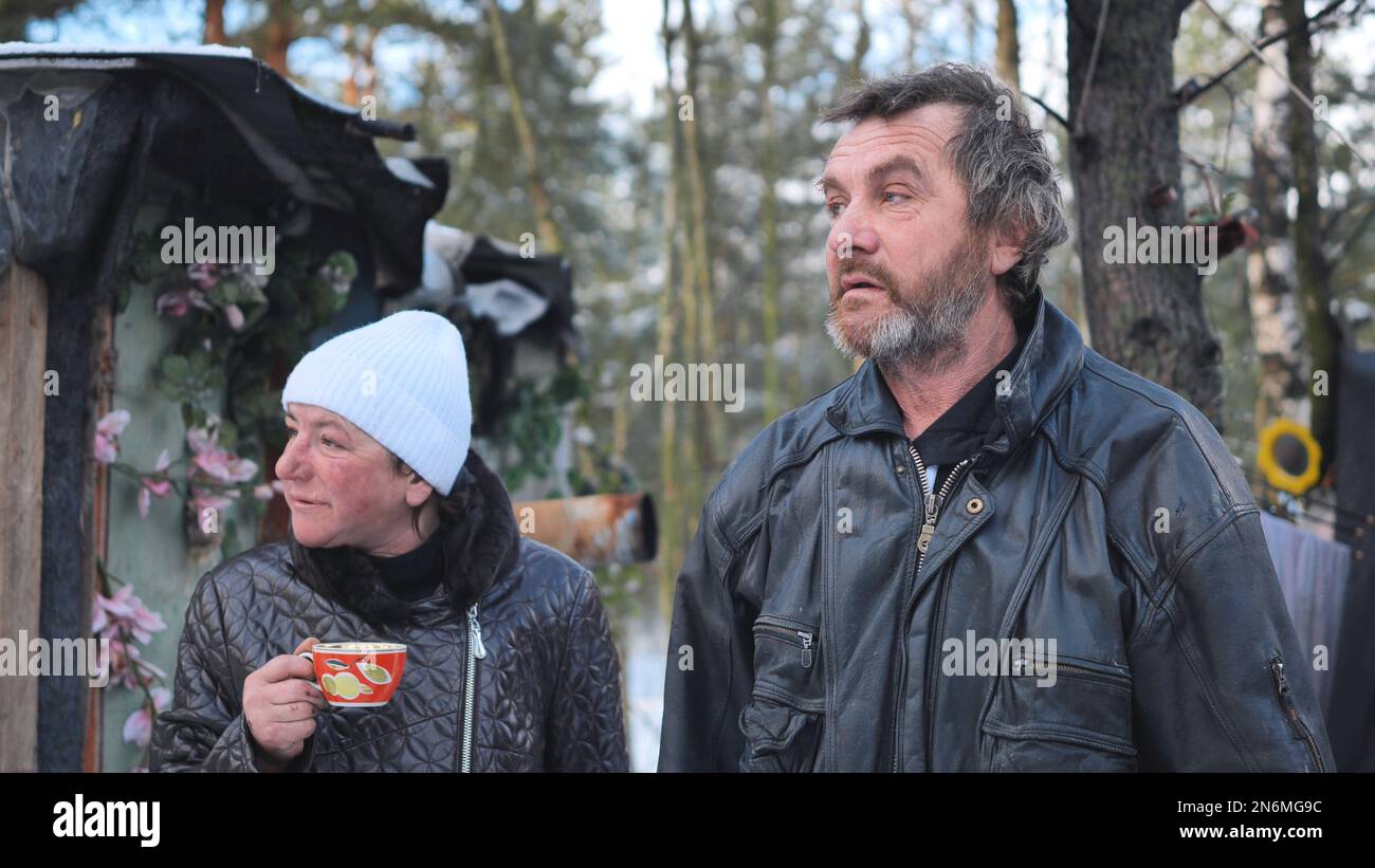 Homeless people are interviewed in the winter in the woods Stock Photo ...