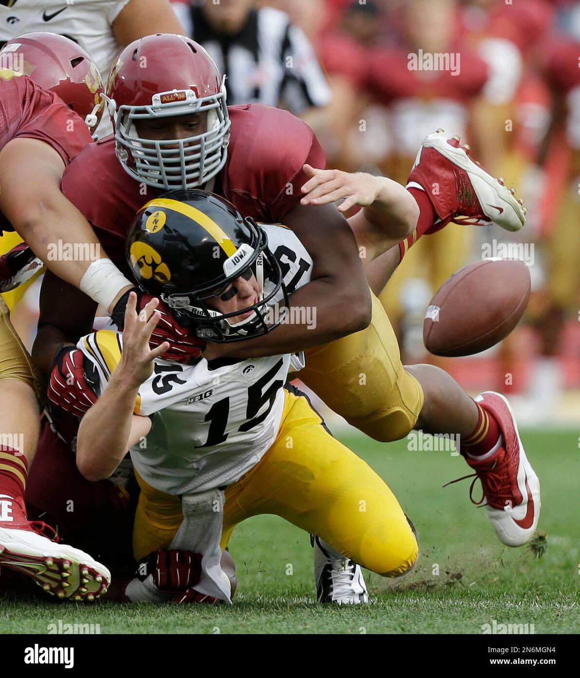 Iowa quarterback Jake Rudock (15) fumbles the ball as he is hit by Iowa ...