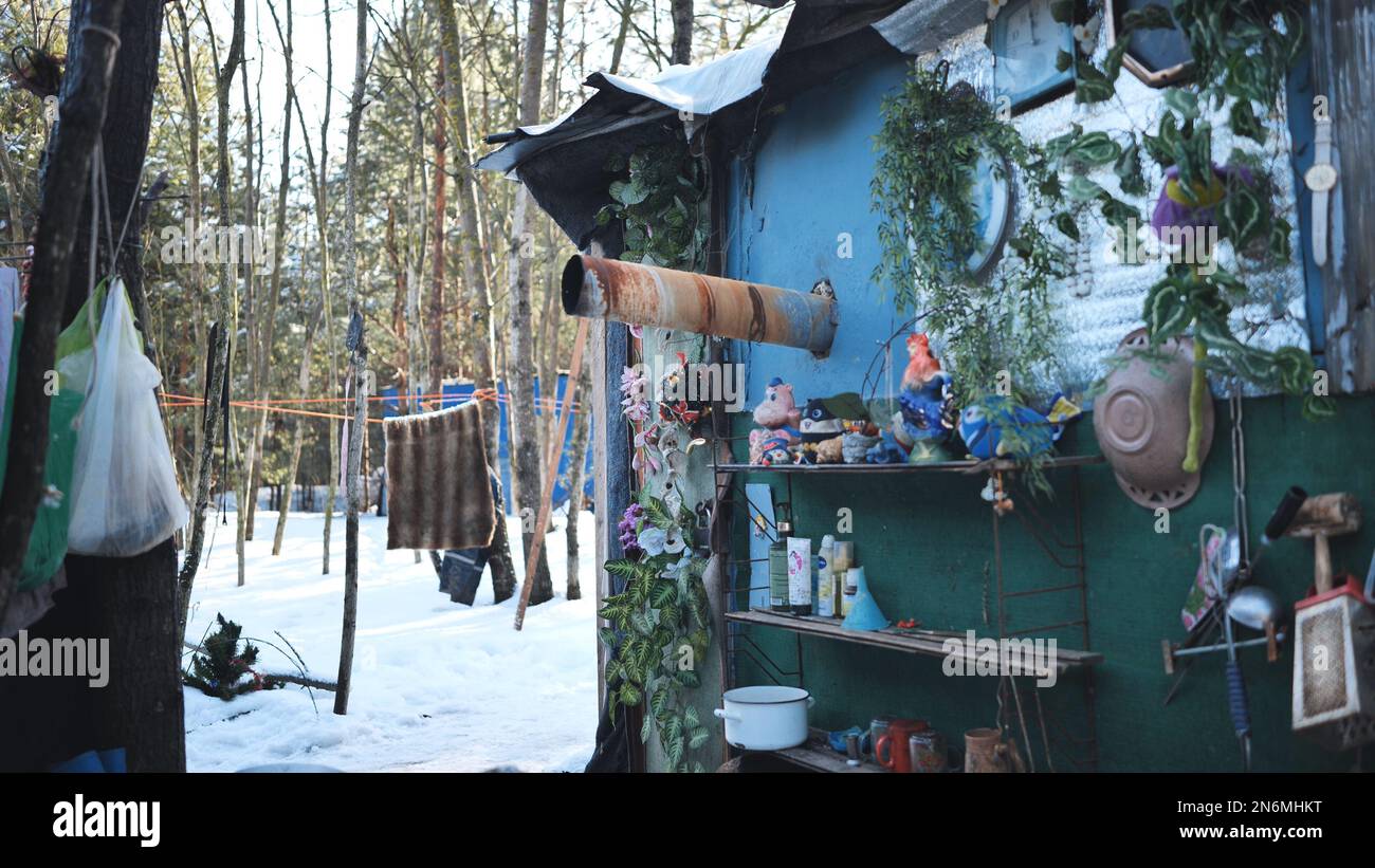 Homeless people go into their huts in the winter in the woods Stock ...