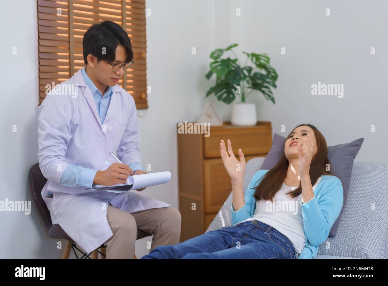 Healthy and medical concept, Male physiotherapist checking injury of ...