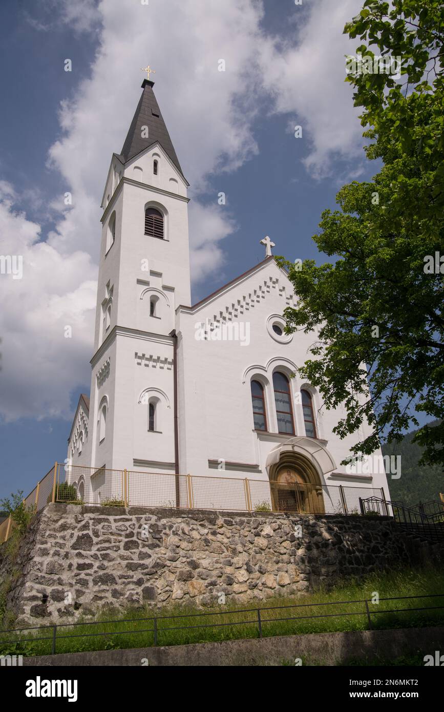 catholic church in summer time with clouds in sky Stock Photo - Alamy