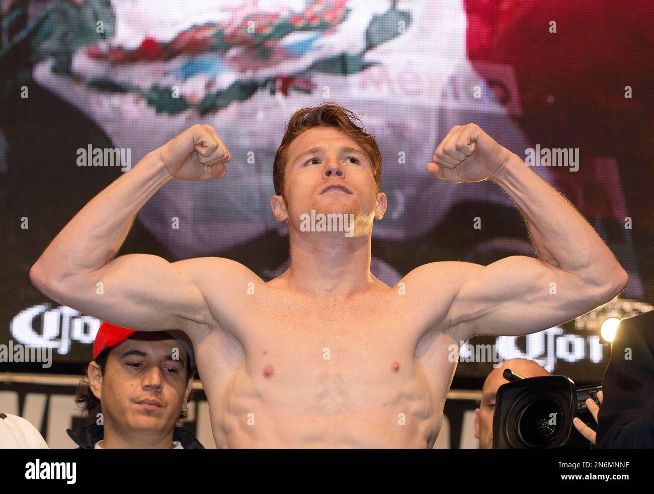 Canelo Alvarez poses for photos on the scale during the weigh-in for ...