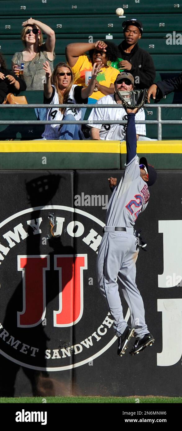 Cleveland Indians center fielder MIchael Bourne catches a fly ball hit ...