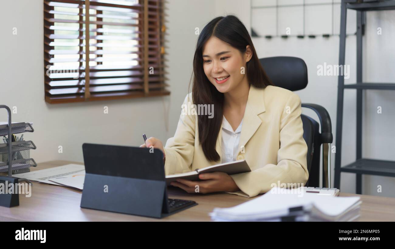 Work of secretary concept, Female secretary pointing data on tablet and ...